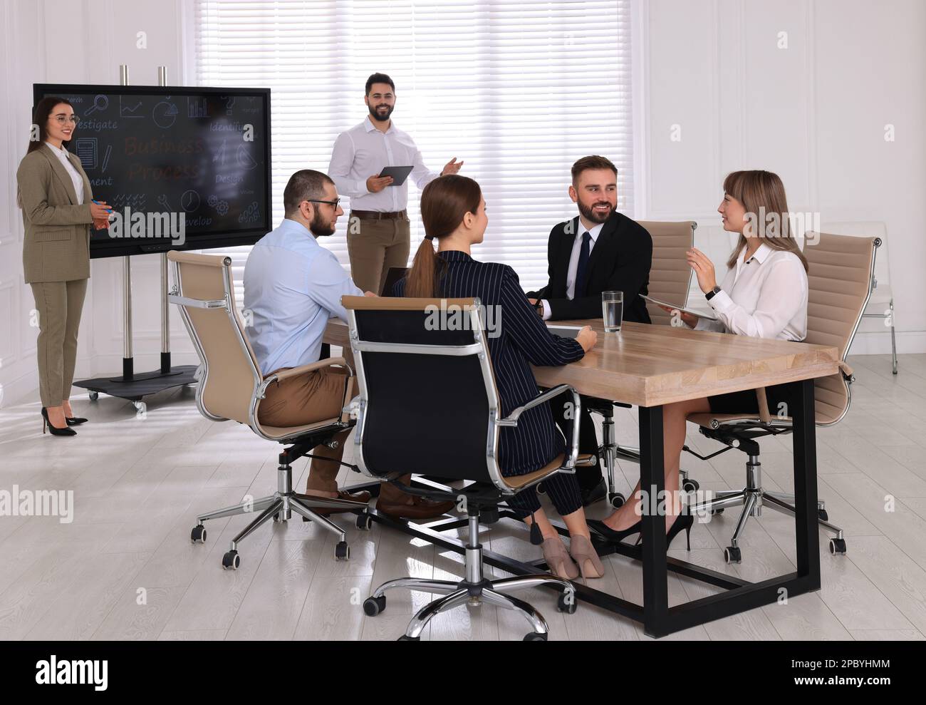 Business training. People in meeting room with interactive board Stock ...