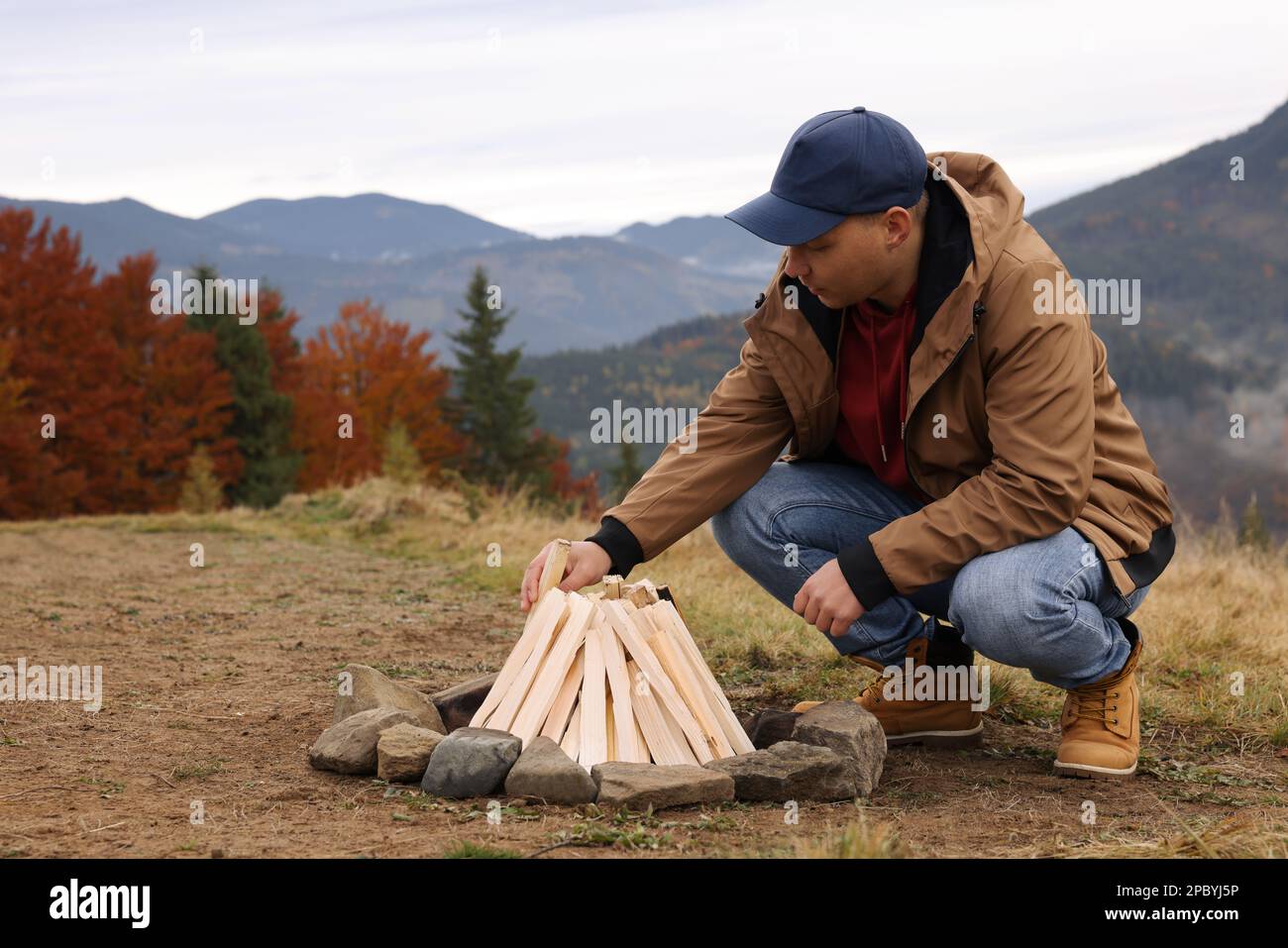 Person making bonfire hi-res stock photography and images - Alamy