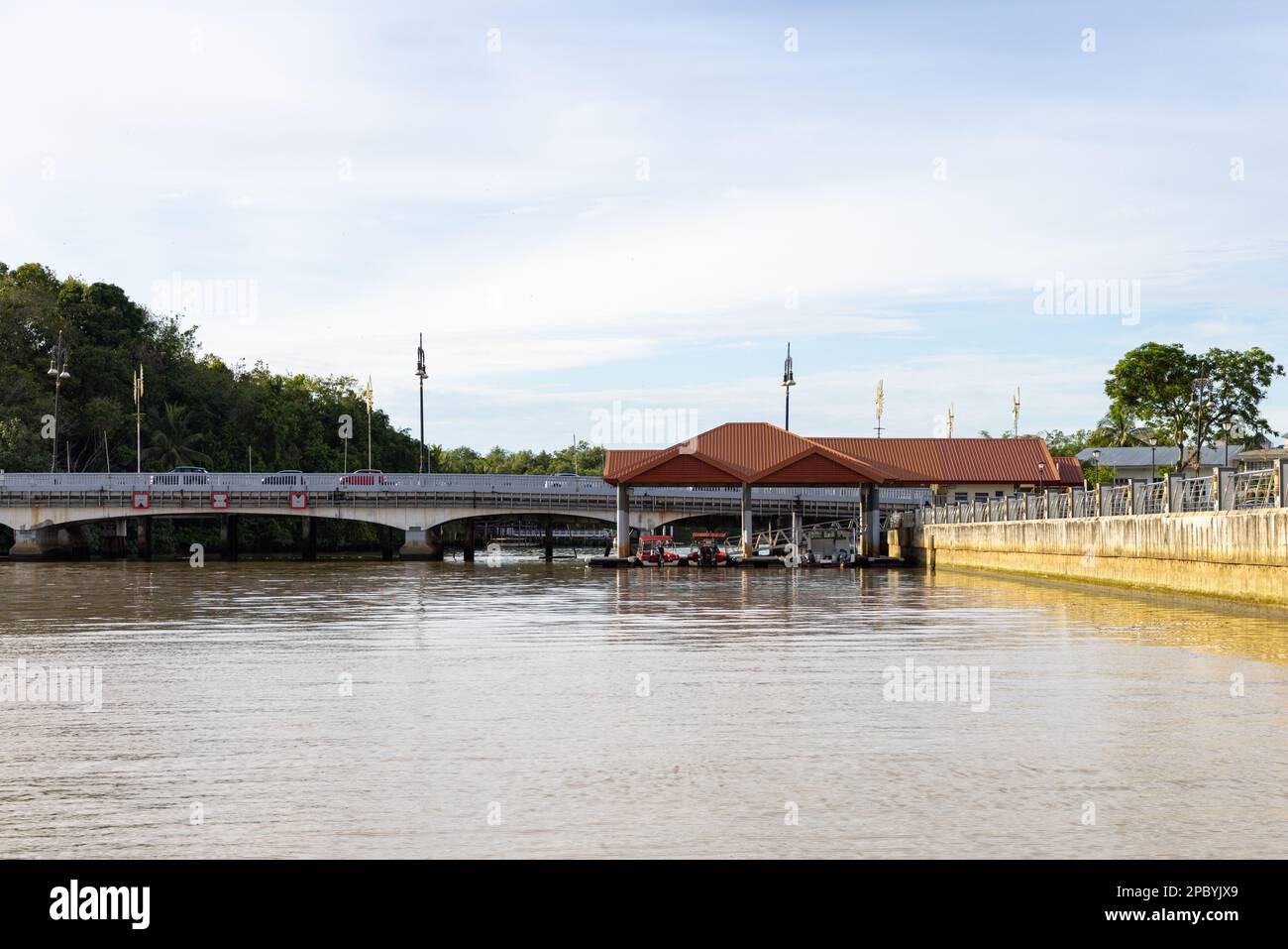 8 3 2023 trees, boat and building along Sungai Kedayan river, the ...