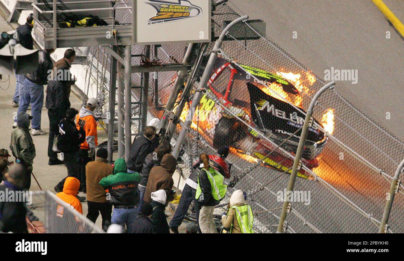 Terry Cook's burning truck heads along the track near the start-finish ...