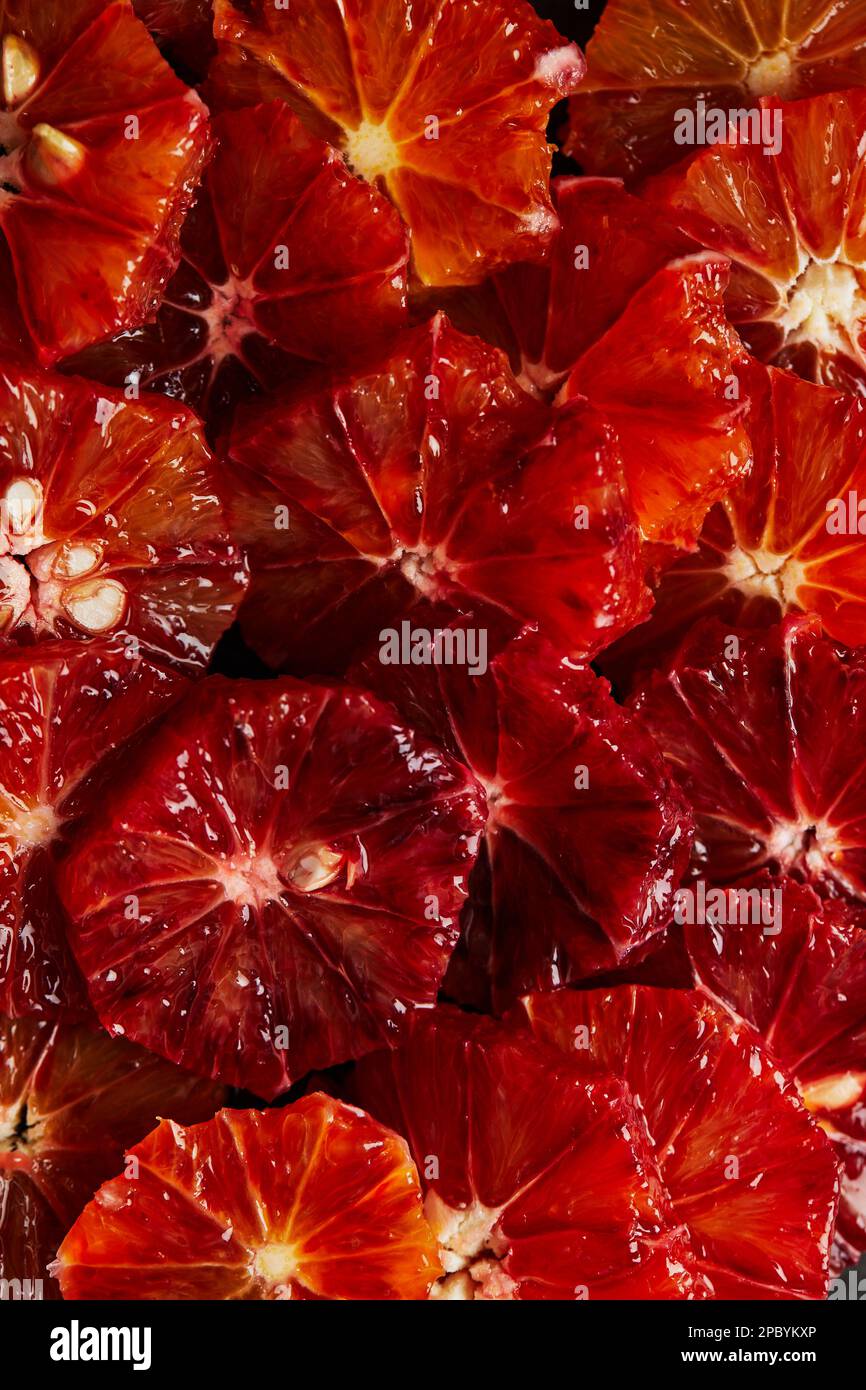 Full frame background of fresh juicy peeled whole ripe bloody oranges ...