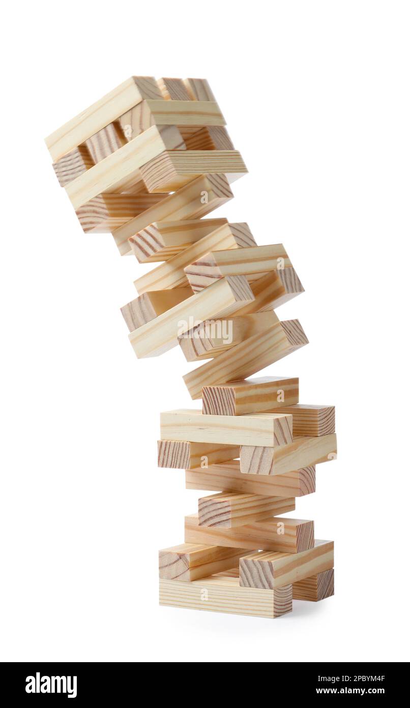 Jenga tower made of wooden blocks falling on white background Stock ...