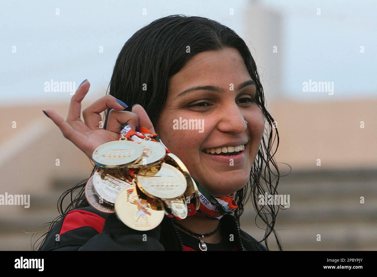 Winner of eight gold medals Richa Mishra of Delhi, displays her medals ...