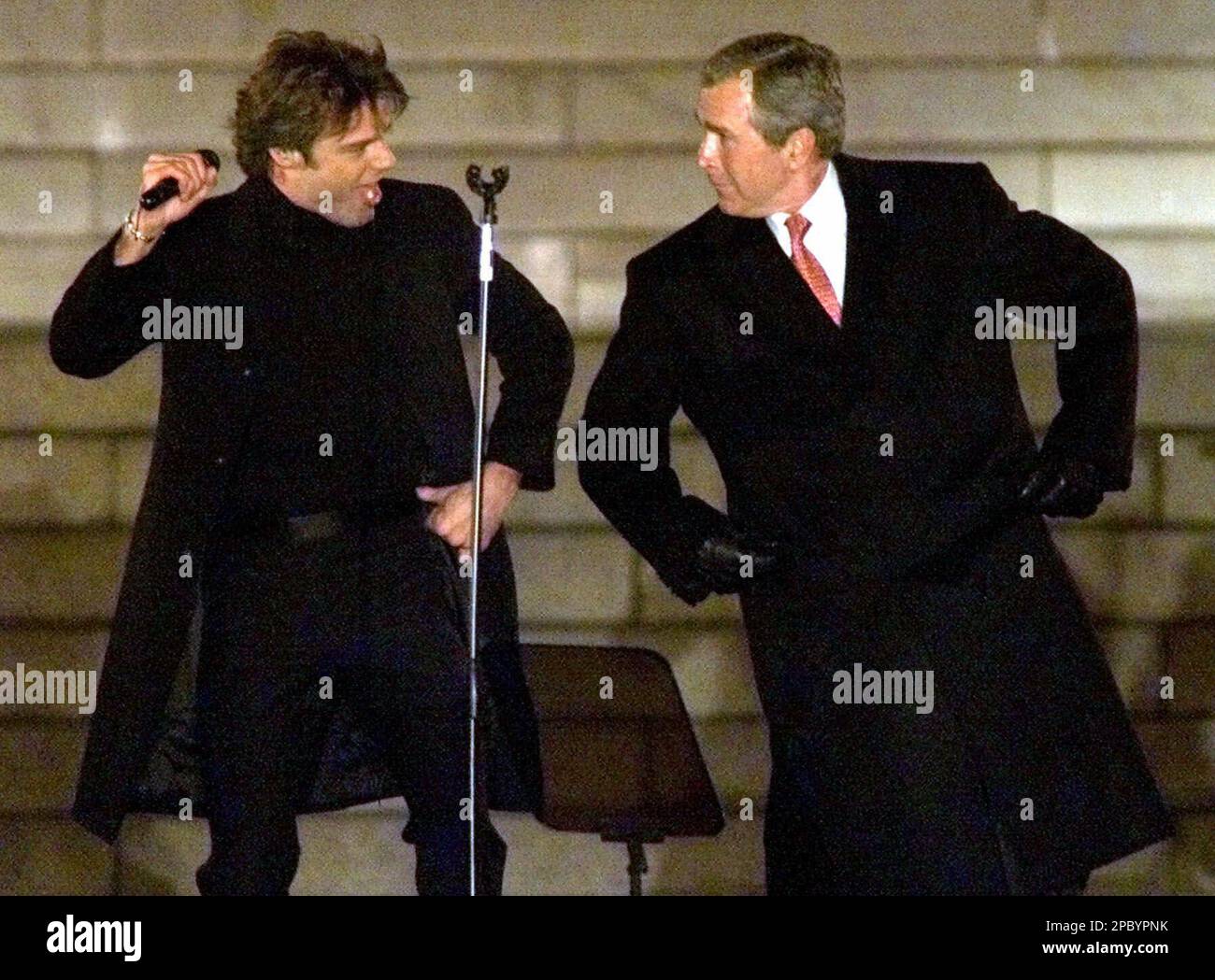 **FILE** President-elect Bush, right, dances with singer Ricky Martin ...