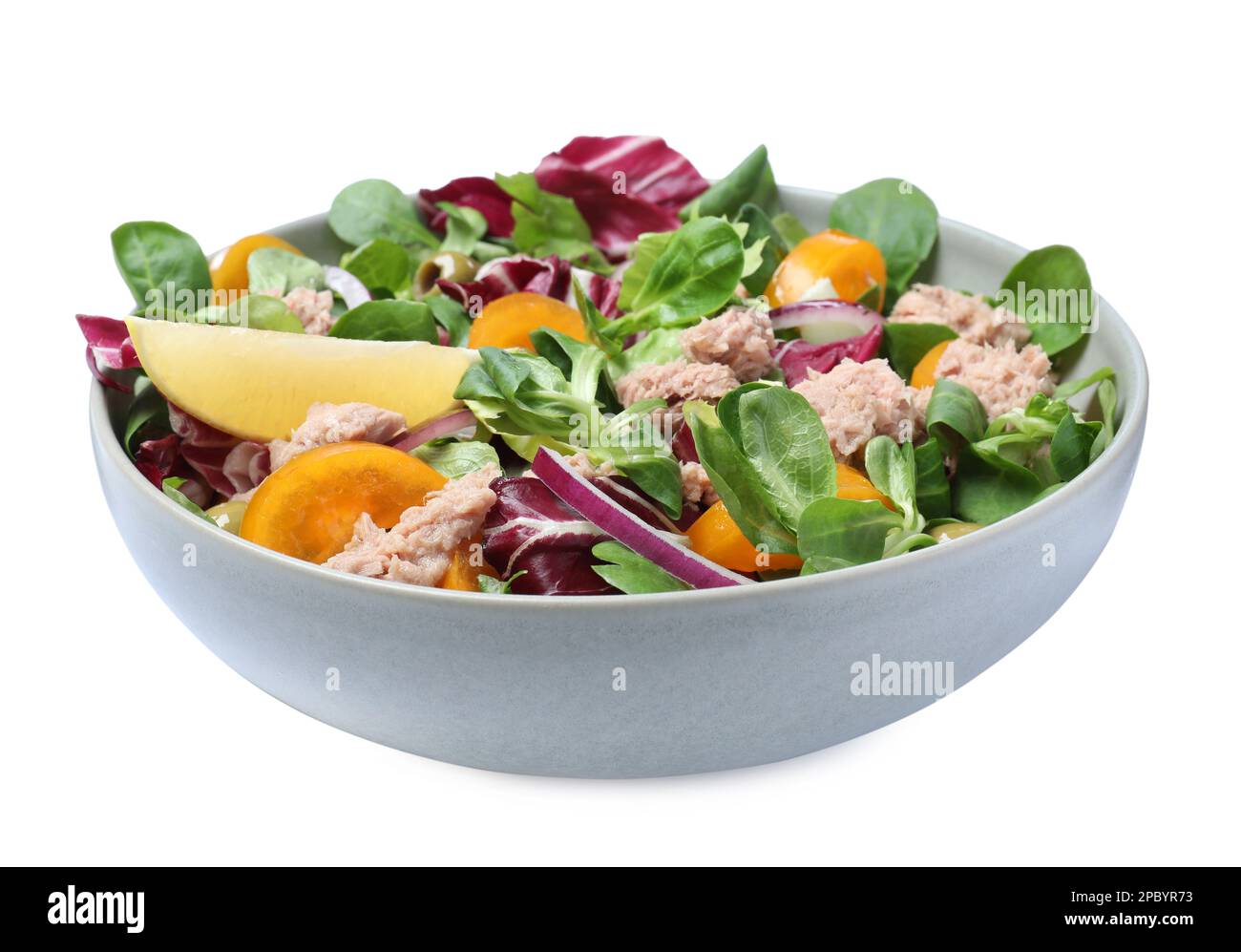Bowl of delicious salad with canned tuna and vegetables on white ...