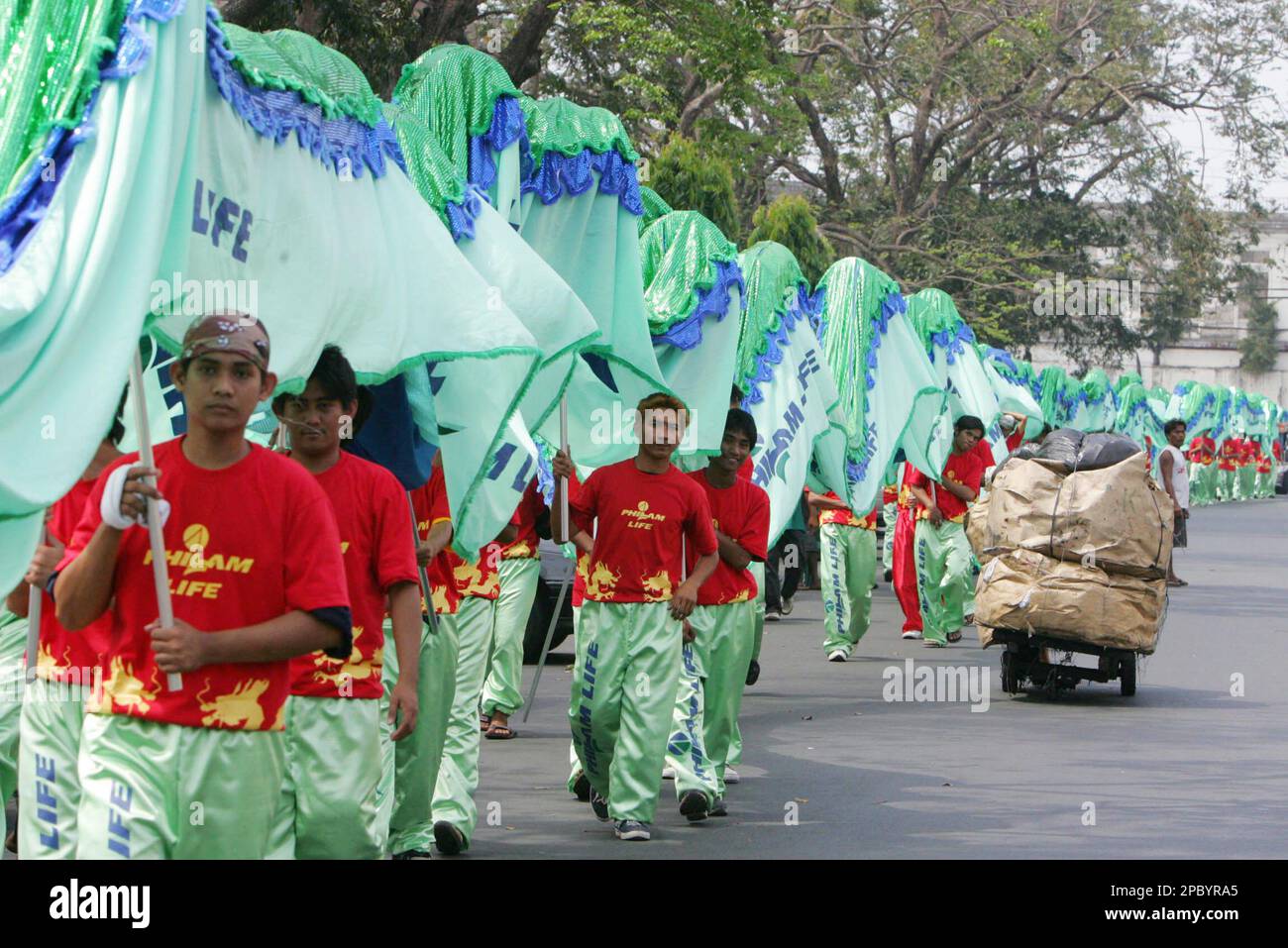 Participants carry a portion of a 1,000-foot long dragon as they ...