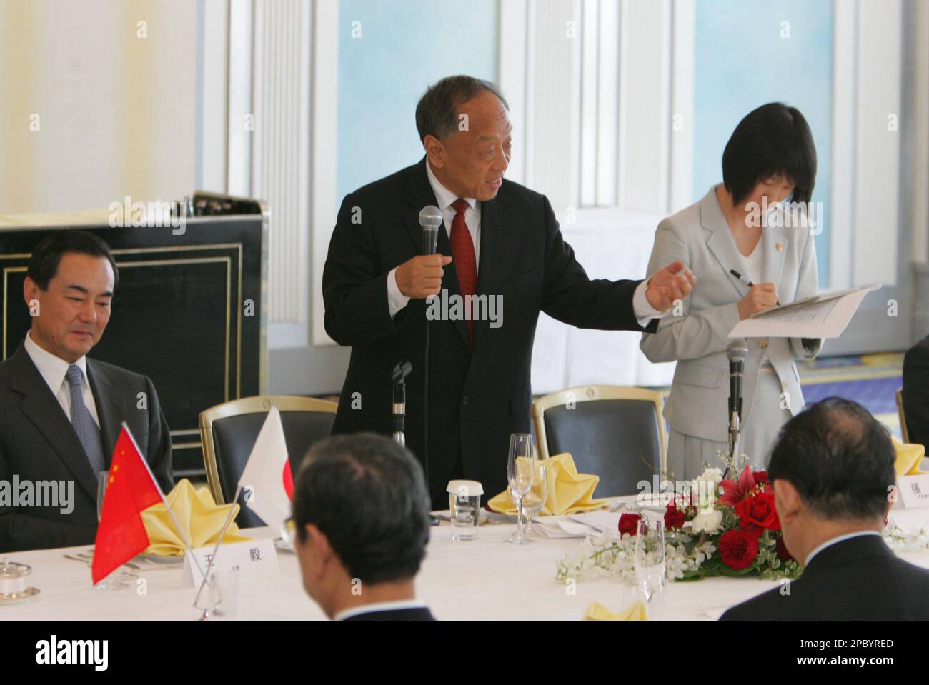 Chinese Foreign Minister Li Zhaoxing, center, makes a speech at a ...