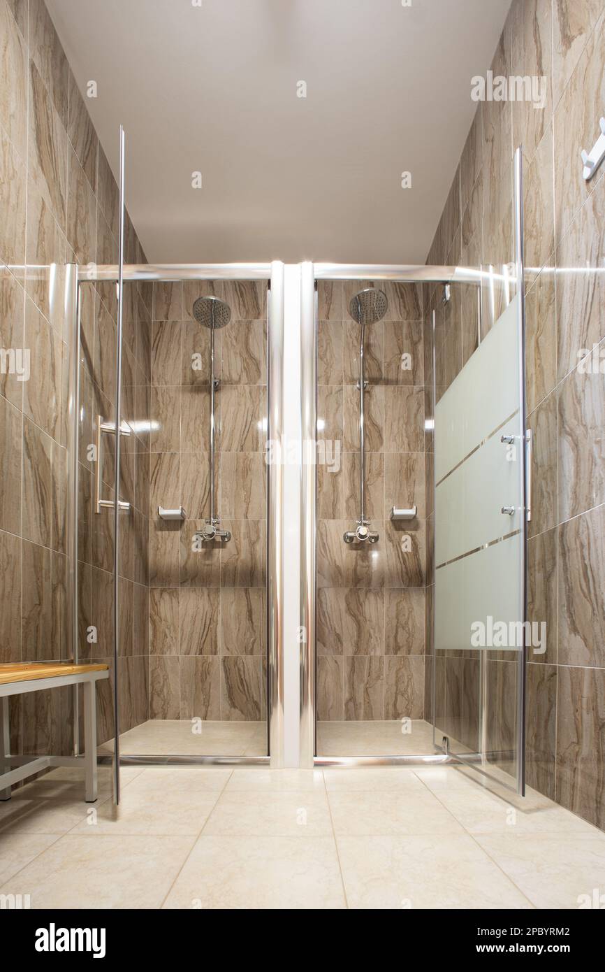 Empty new double shower cabins inside a fitness center, no people Stock Photo - Alamy