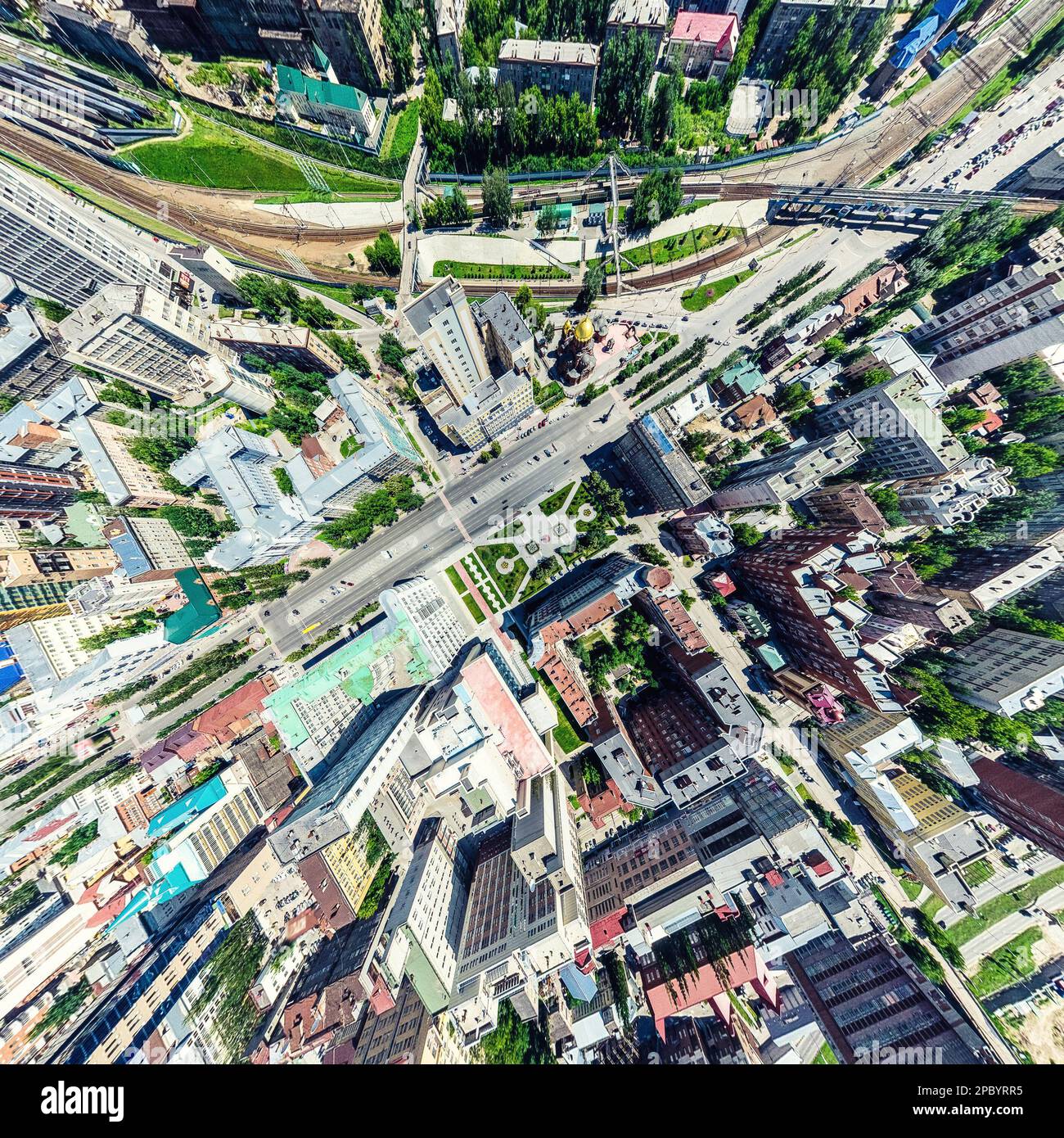 Aerial city view with crossroads and roads, houses, buildings, parks ...
