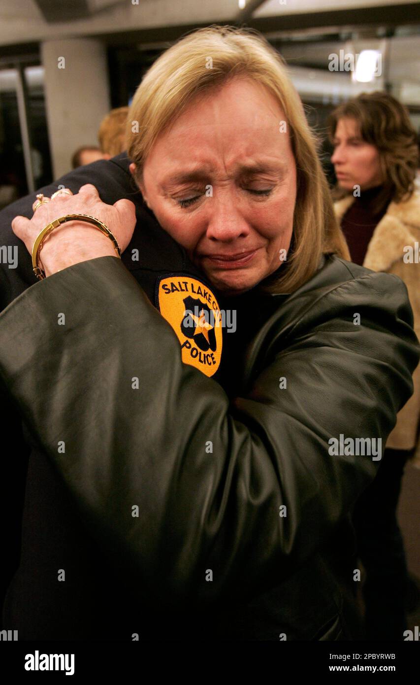Anne Bagley tearfully hugs Salt Lake City Police Chief Chris Burbank to ...