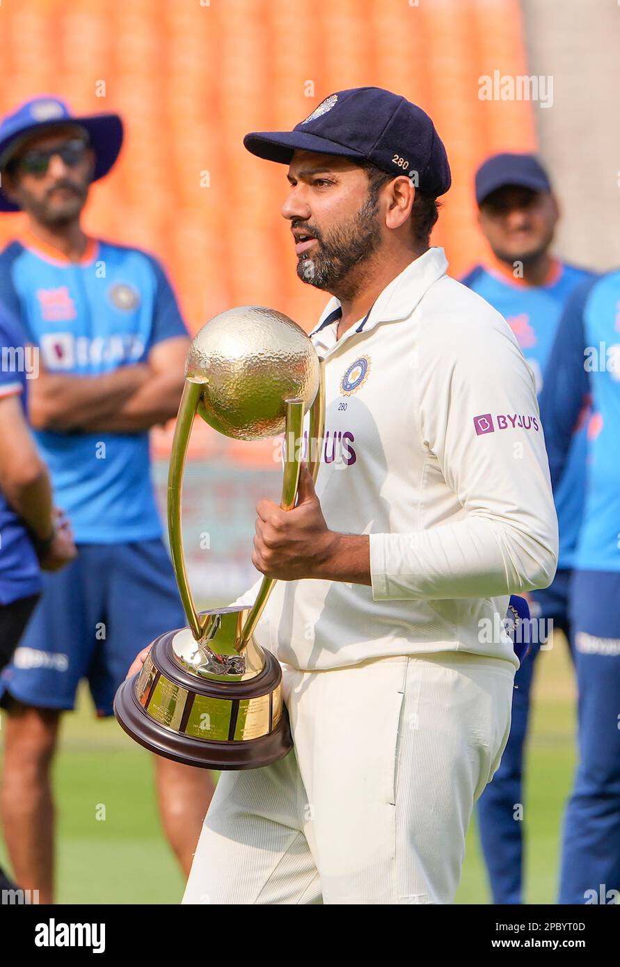 India's captain Rohit Sharma holds the trophy after winning the The ...