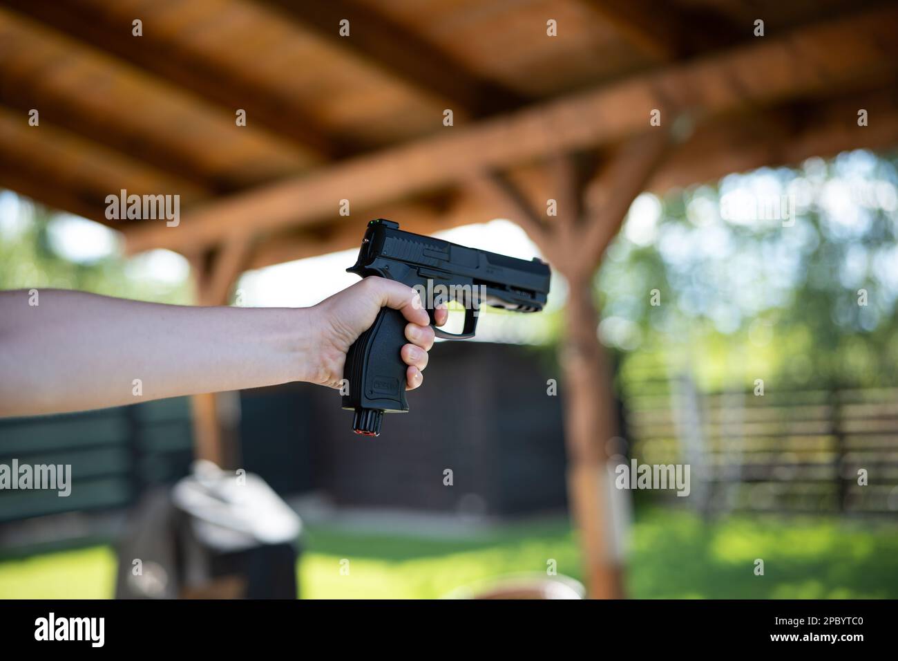 Woman aiming hand gun hi-res stock photography and images - Alamy
