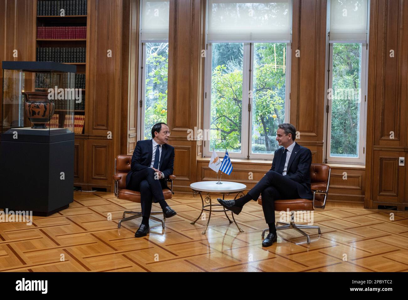 Greek Prime Ministers Kyriakos Mitsotakis , right, talks with Cyprus ...