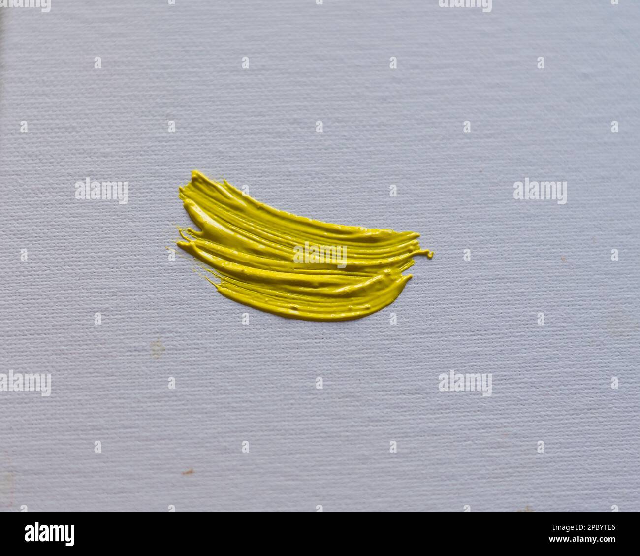 Smear of yellow gouache paint on white paper Stock Photo - Alamy