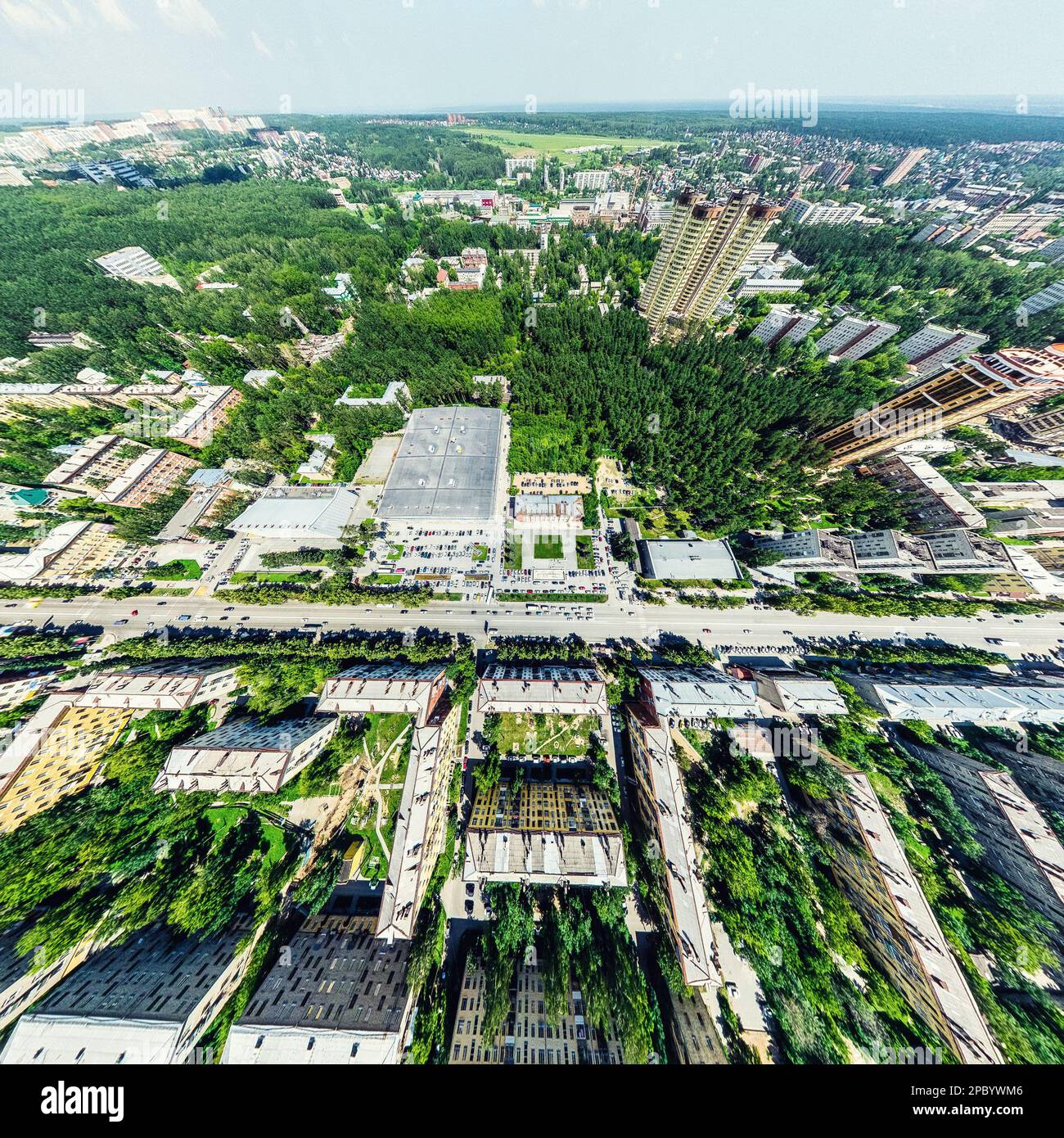 Aerial city view with crossroads and roads, houses, buildings, parks ...