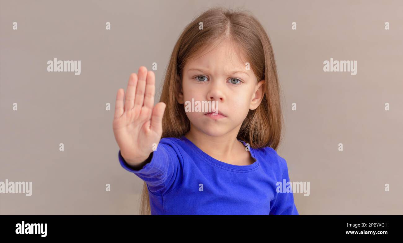 Child showing hand as sign to stop focus on kid, isolated on white ...