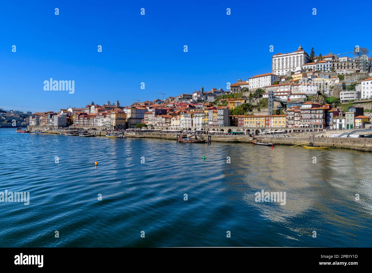 The beautiful old port of Porto with the Cais da Ribeira on the ...