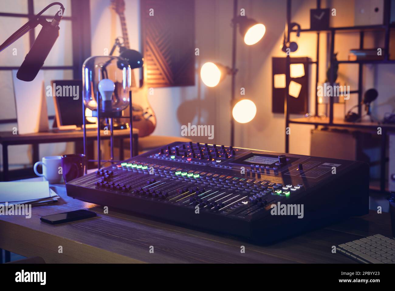 Professional mixing console on table in radio studio Stock Photo - Alamy