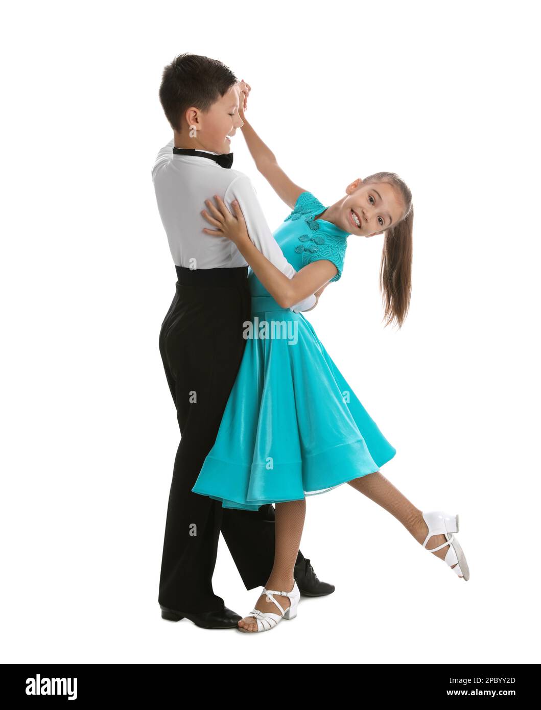 Beautifully dressed couple of kids dancing on white background Stock ...