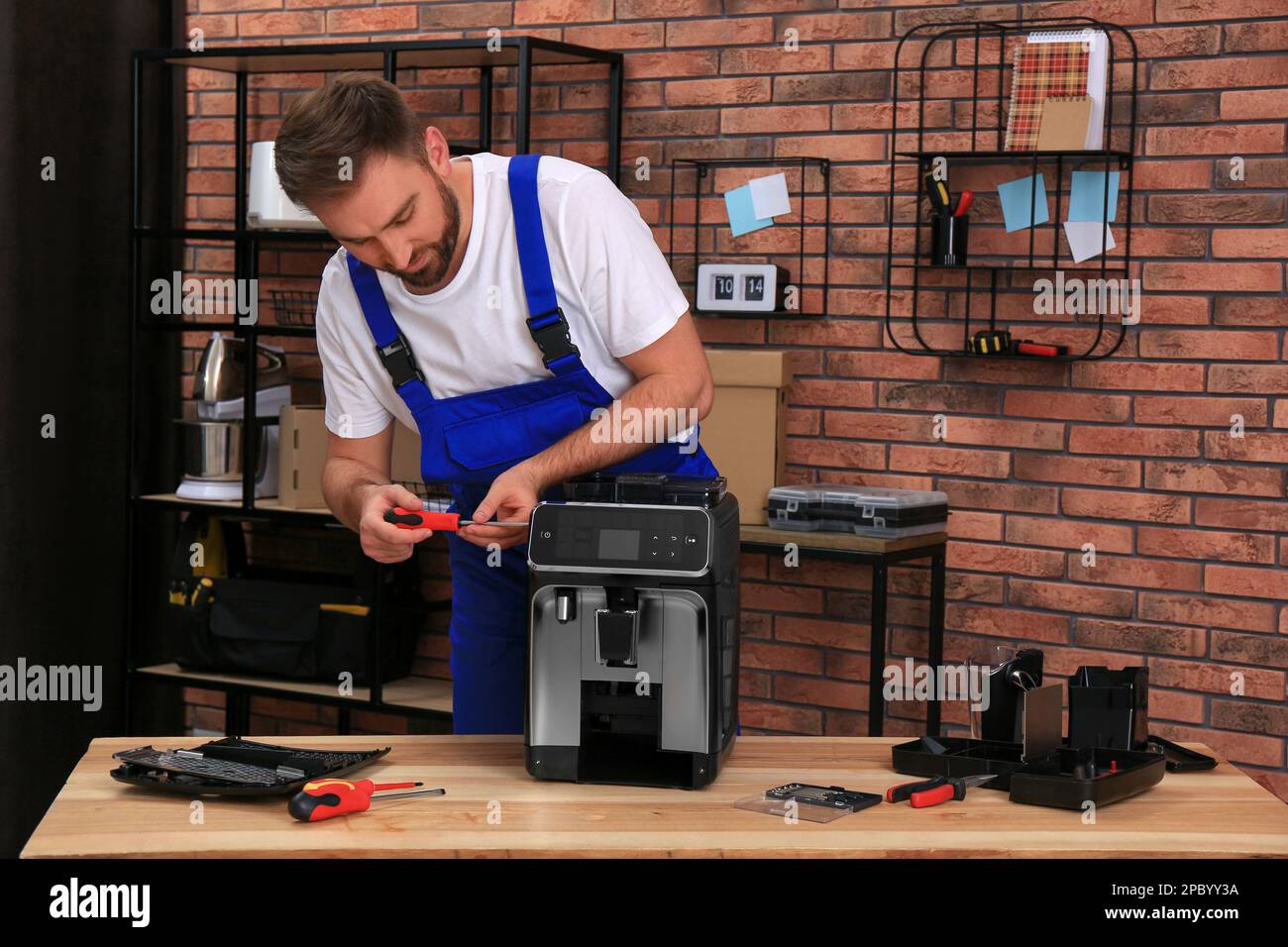 Male repairman coffee machine hi-res stock photography and images - Alamy