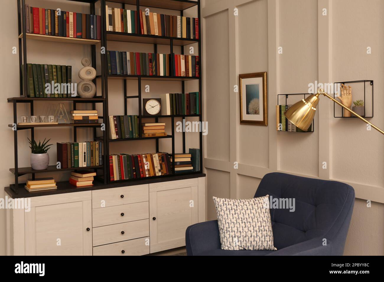 Cozy home library interior with collection of different books on ...