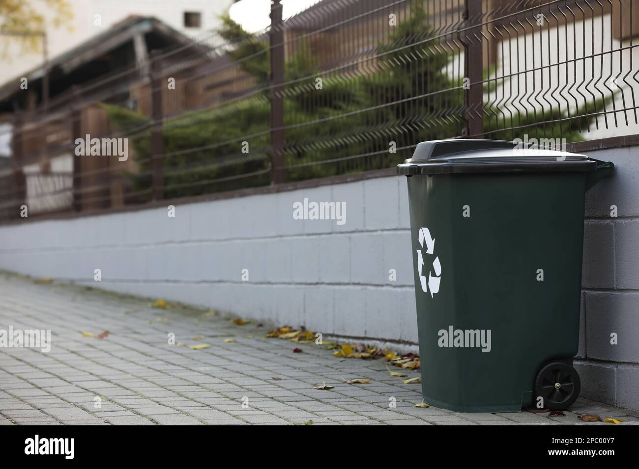 Garbage bin outdoors, space for text. Waste recycling Stock Photo - Alamy
