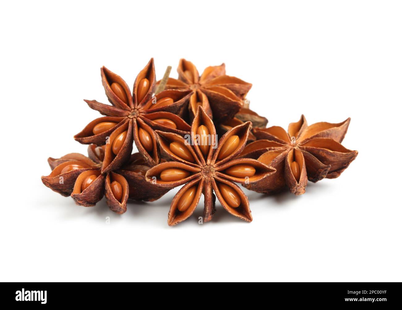 Dry anise stars with seeds on white background Stock Photo - Alamy