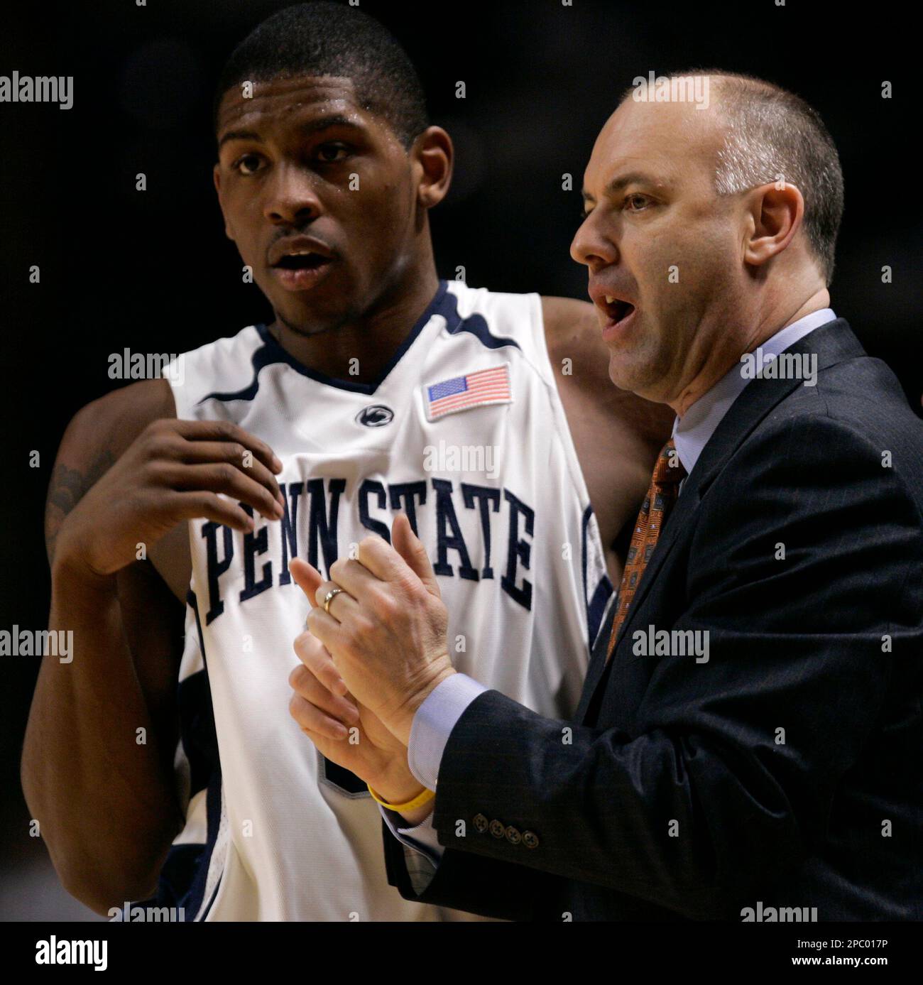 Penn State head coach Ed DeChellis, right, talks with forward Geary ...