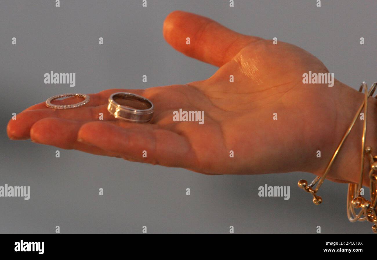 A marriage official offers Elaine Magallon and Christian Jorda, of ...