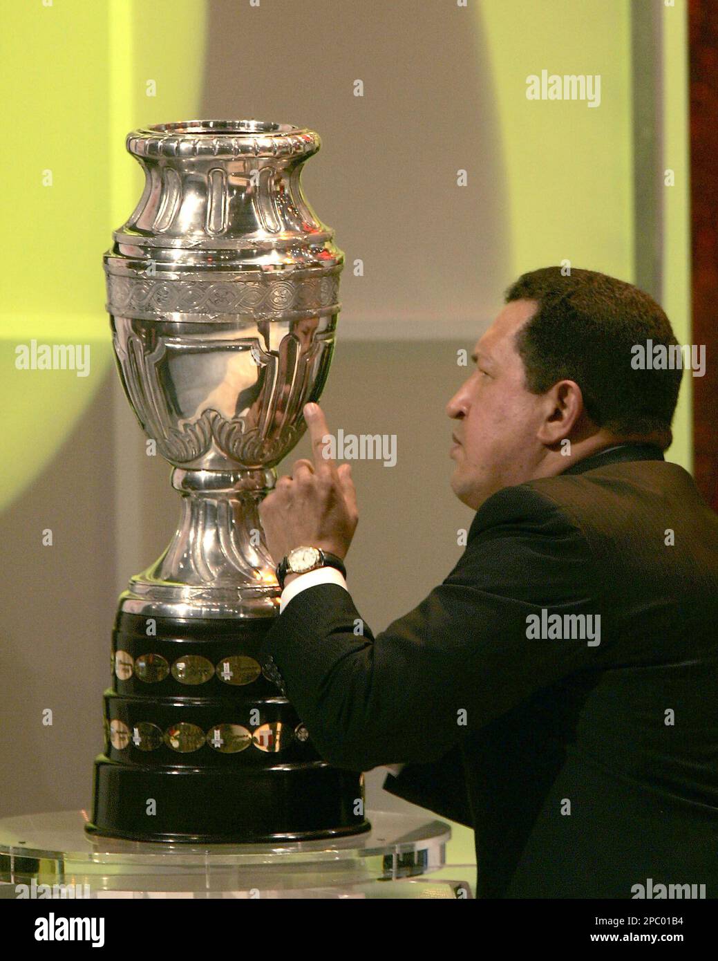 Venezuela's President Hugo Chavez touches the Copa America's trophy ...