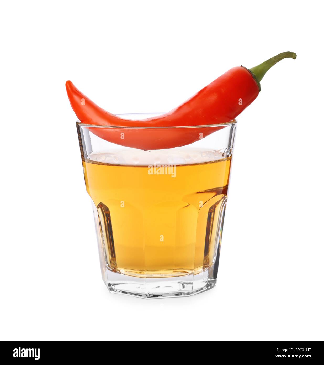 Red hot chili pepper and vodka in glass on white background Stock Photo ...