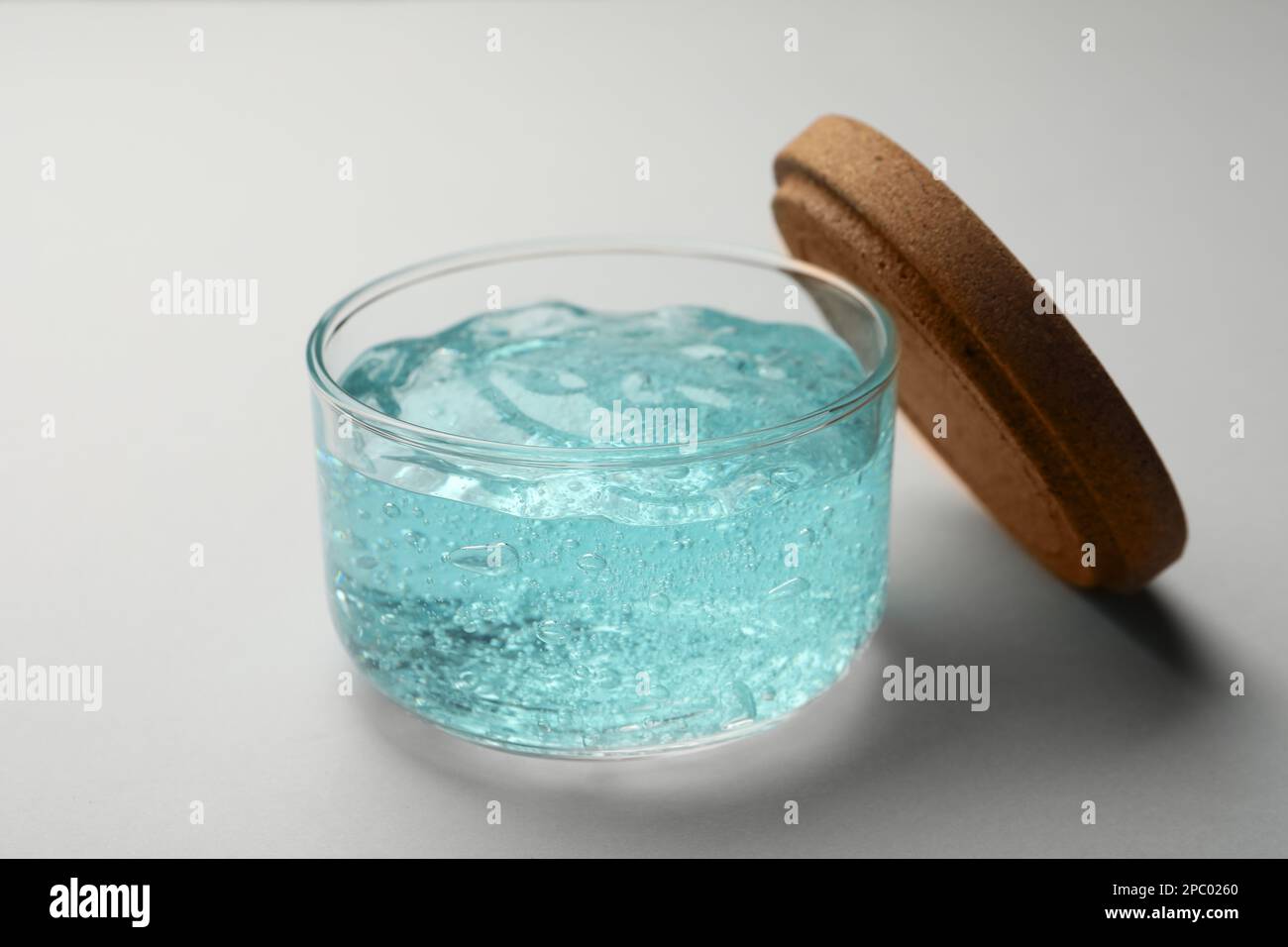 Jar of blue cosmetic gel on light background Stock Photo - Alamy