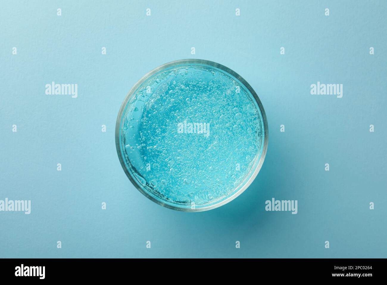 Jar of cosmetic gel on light blue background, top view Stock Photo - Alamy