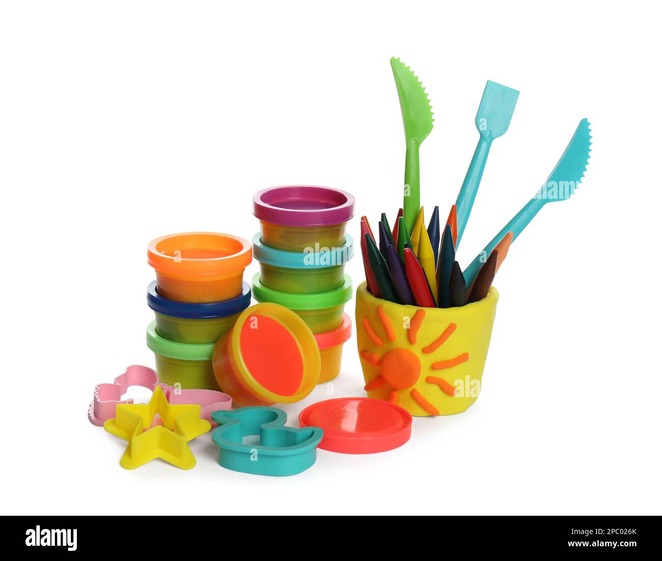 Set of bright play dough with tools and colorful pencils on white ...
