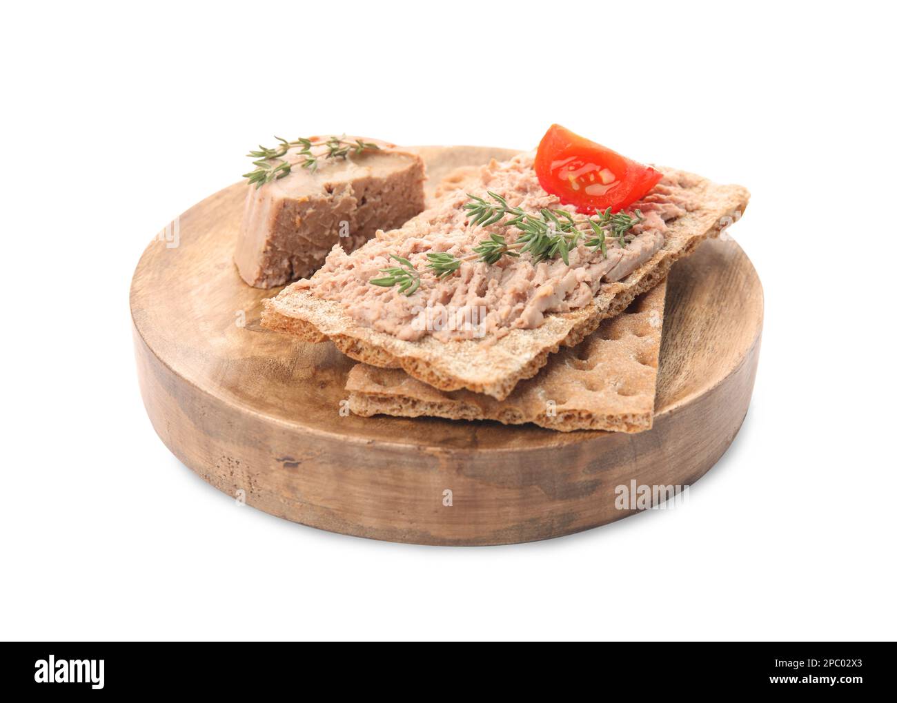 Crispy crackers with delicious meat pate, tomato and thyme isolated on ...