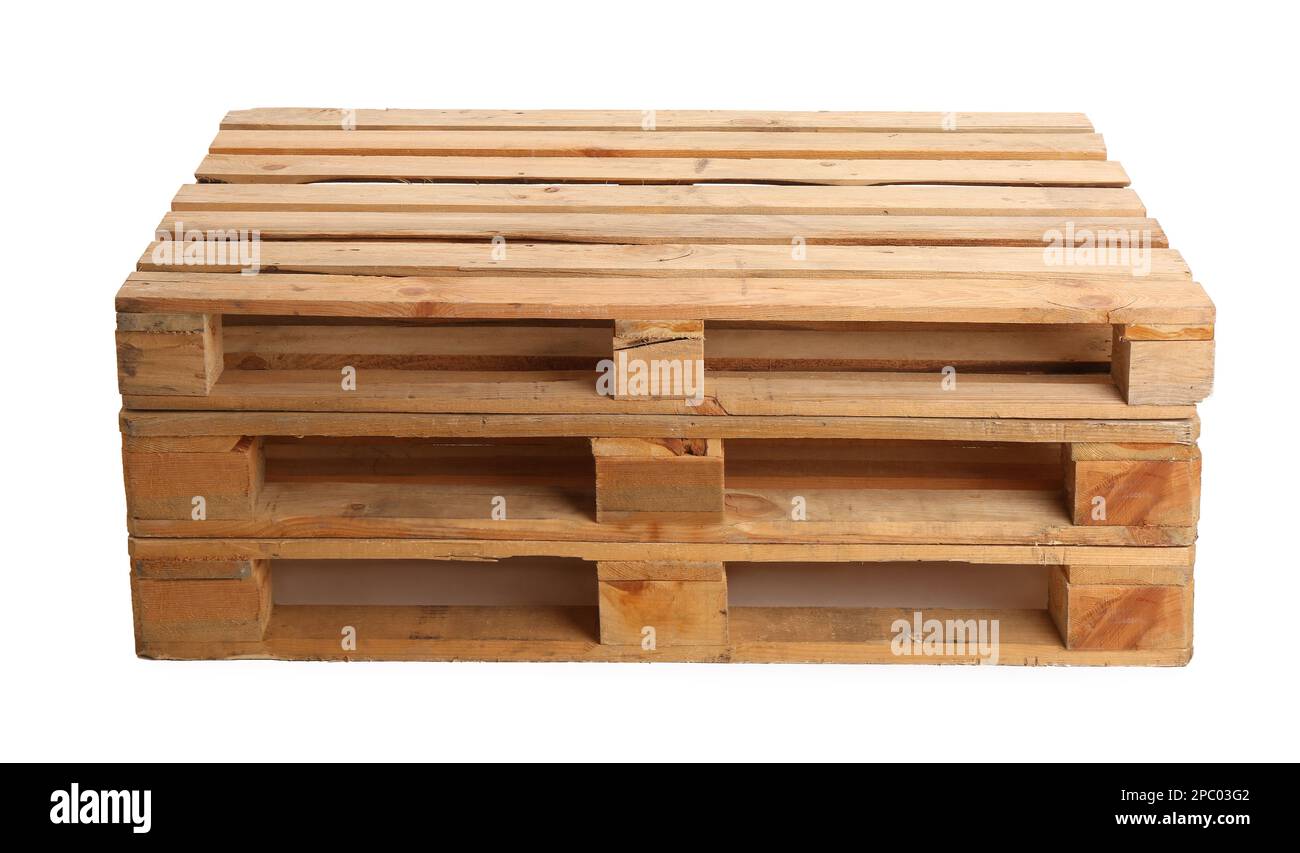 Stacked wooden pallets isolated on white. Transportation and storage ...