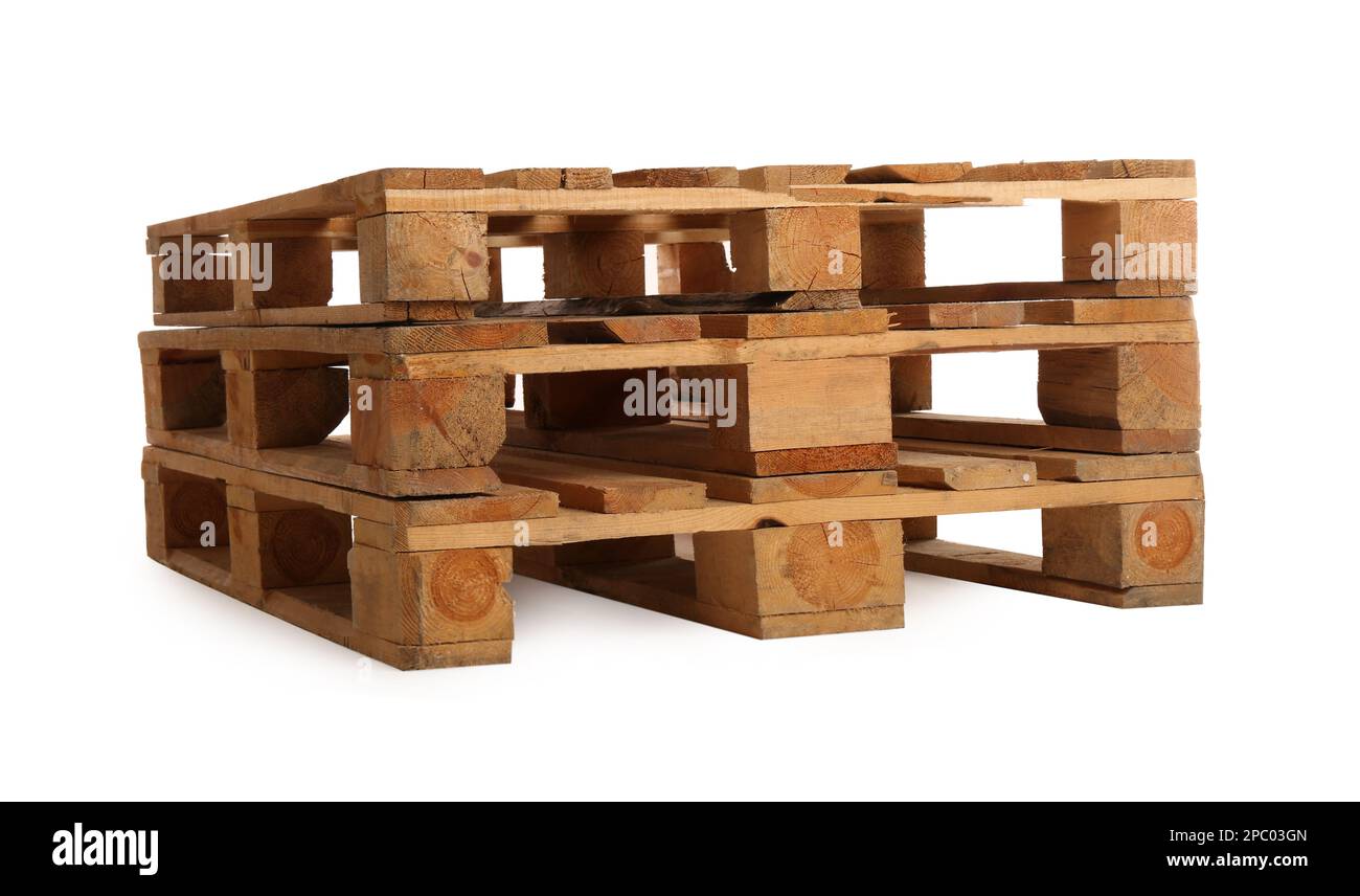 Stacked wooden pallets isolated on white. Transportation and storage ...