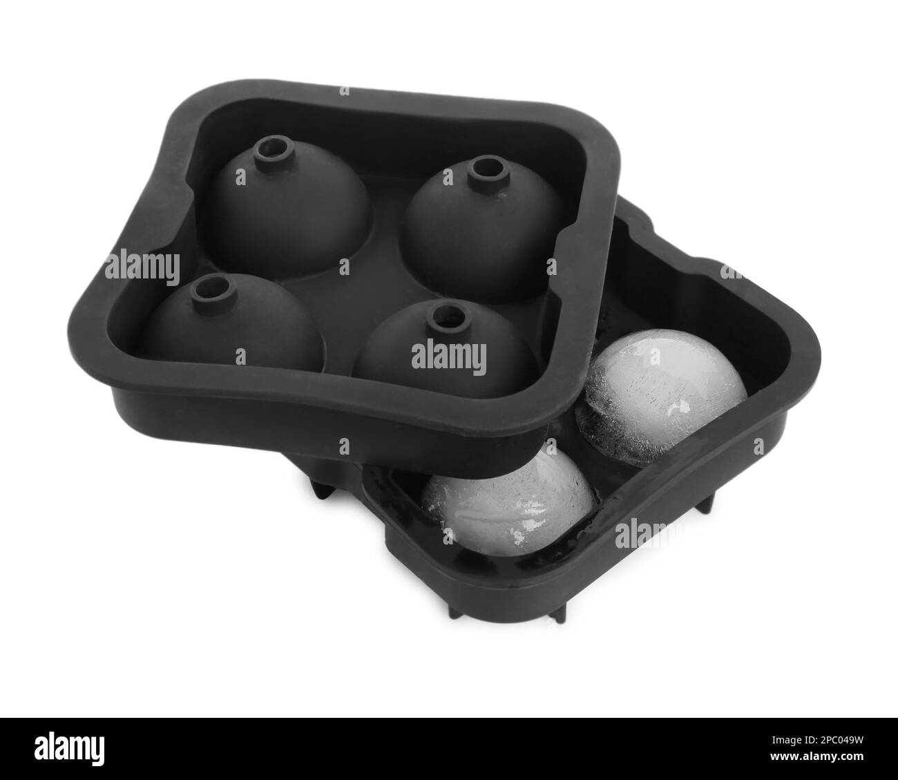 Frozen ice balls in mold on white background Stock Photo - Alamy