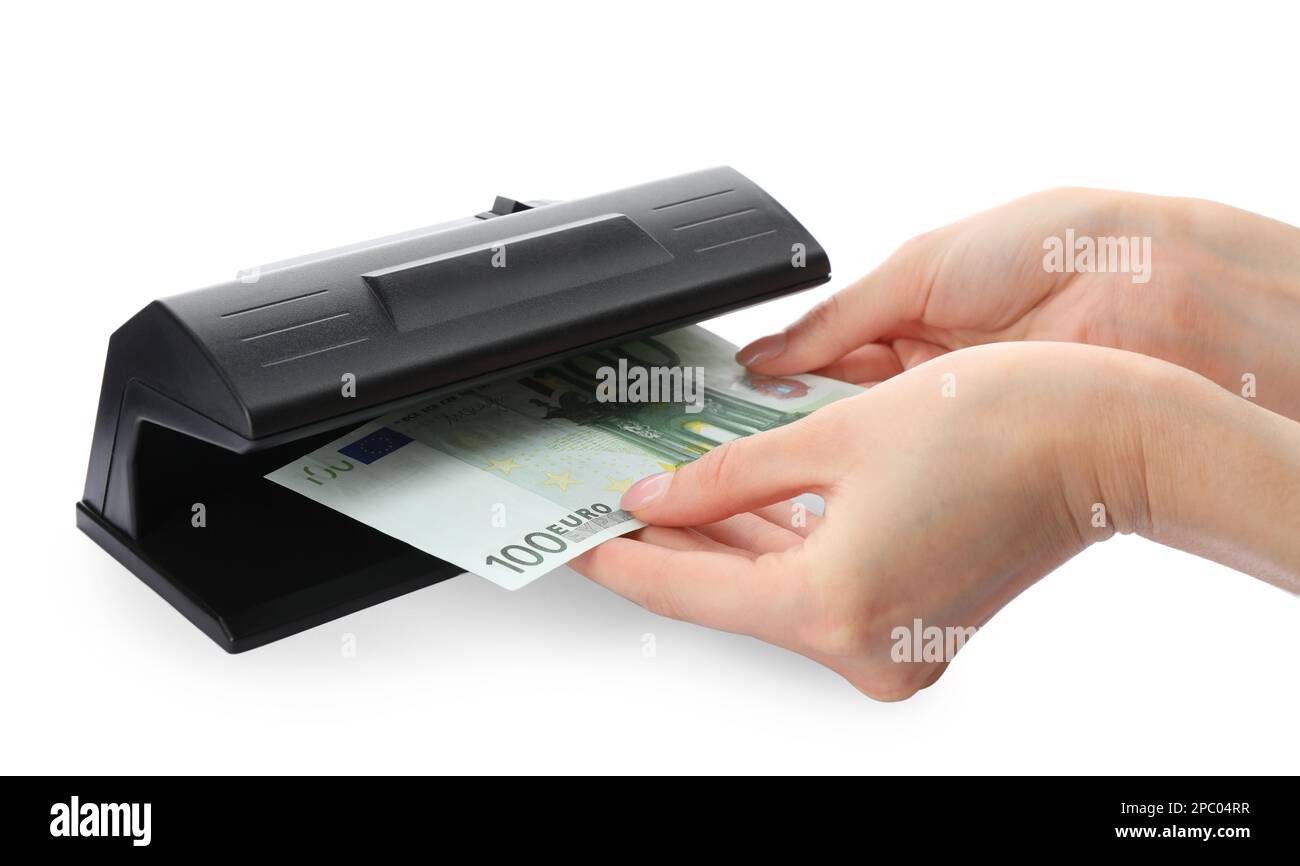 Woman checking Euro banknote with currency detector on white background ...