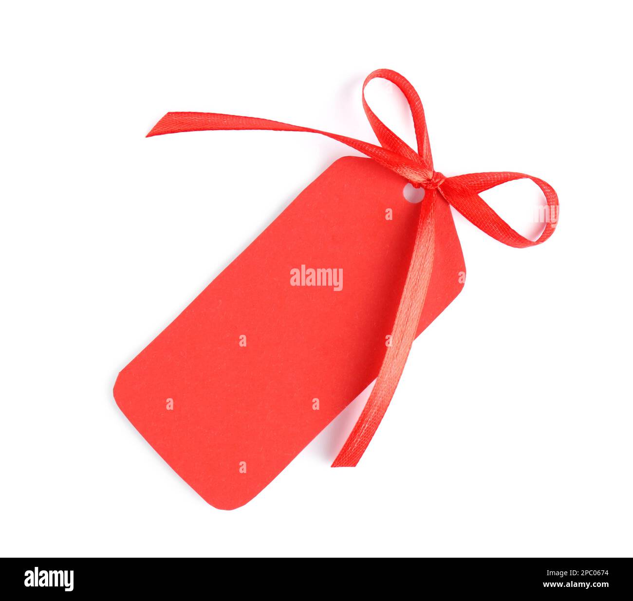 Blank red gift tag with satin ribbon on white background, top view ...