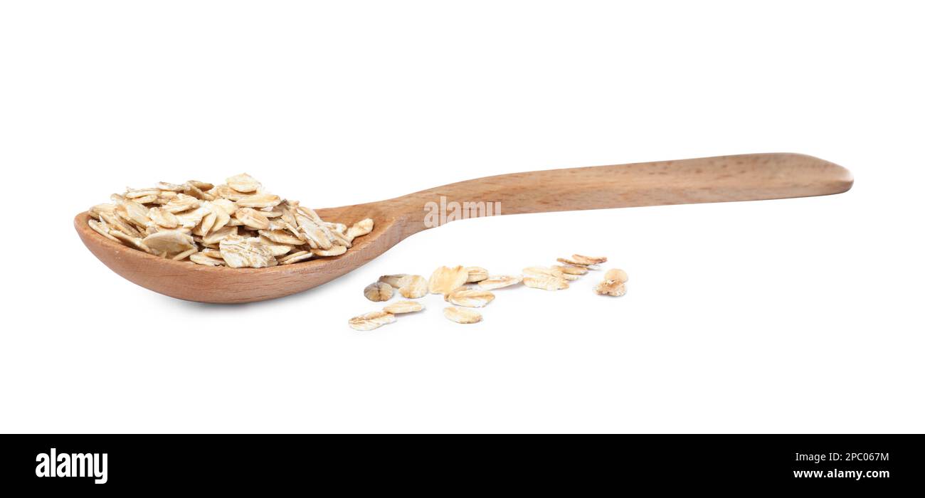 Raw oatmeal and wooden spoon on white background Stock Photo - Alamy