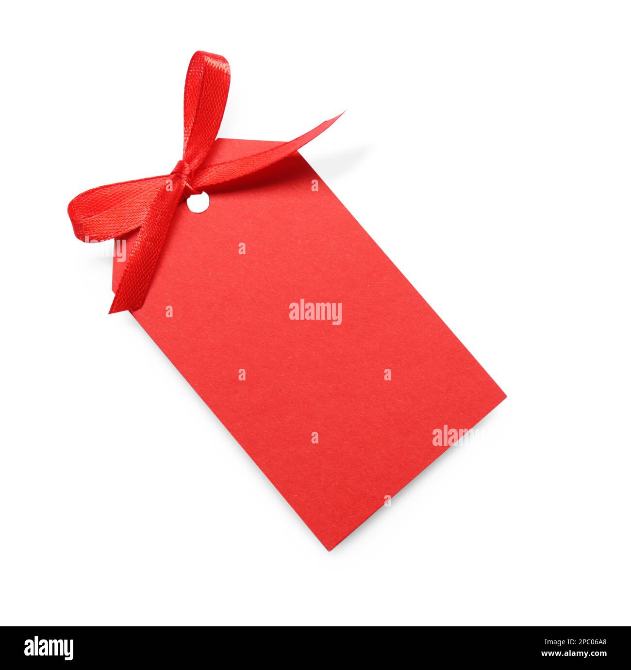 Blank red gift tag with satin ribbon on white background, top view ...