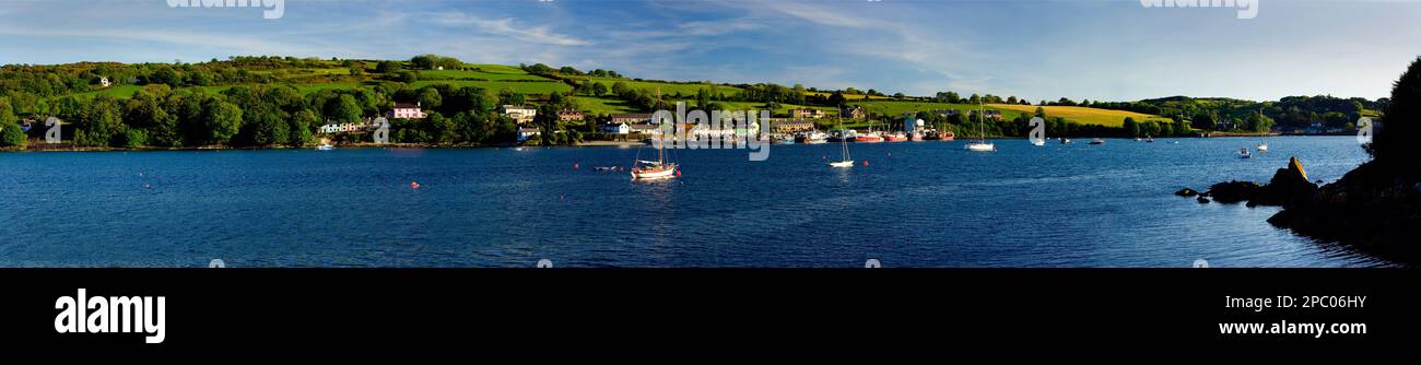 Boats ride at anchor by the fishing village of Union Hall that is ...