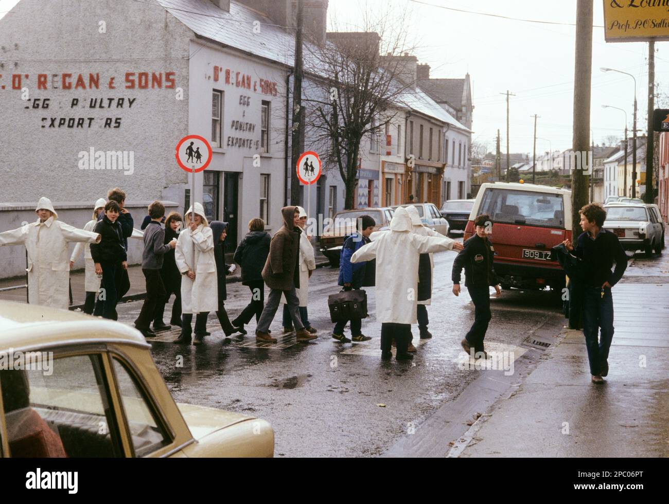 School children cross Clonakilty Main Street as crossing guards stop ...