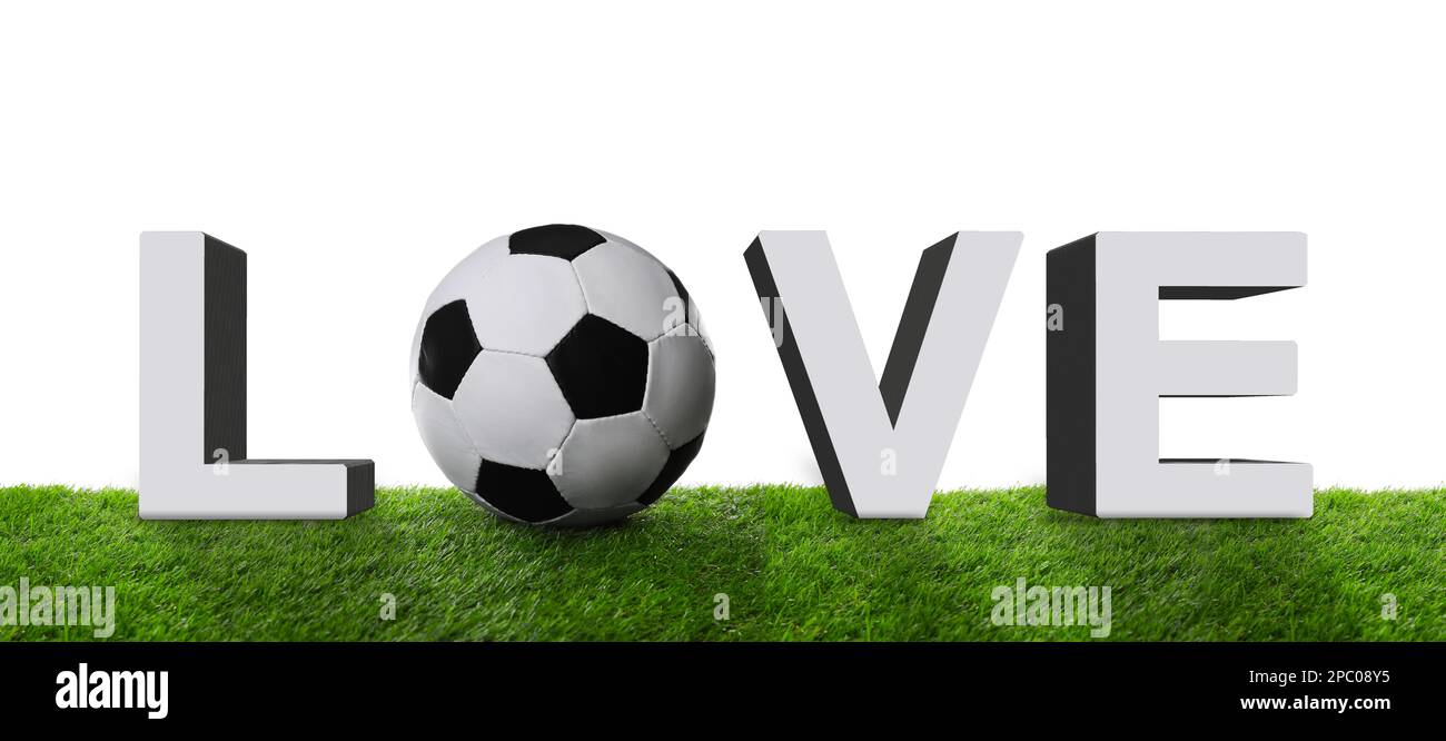 Word LOVE made of letters and soccer ball on green grass against white ...