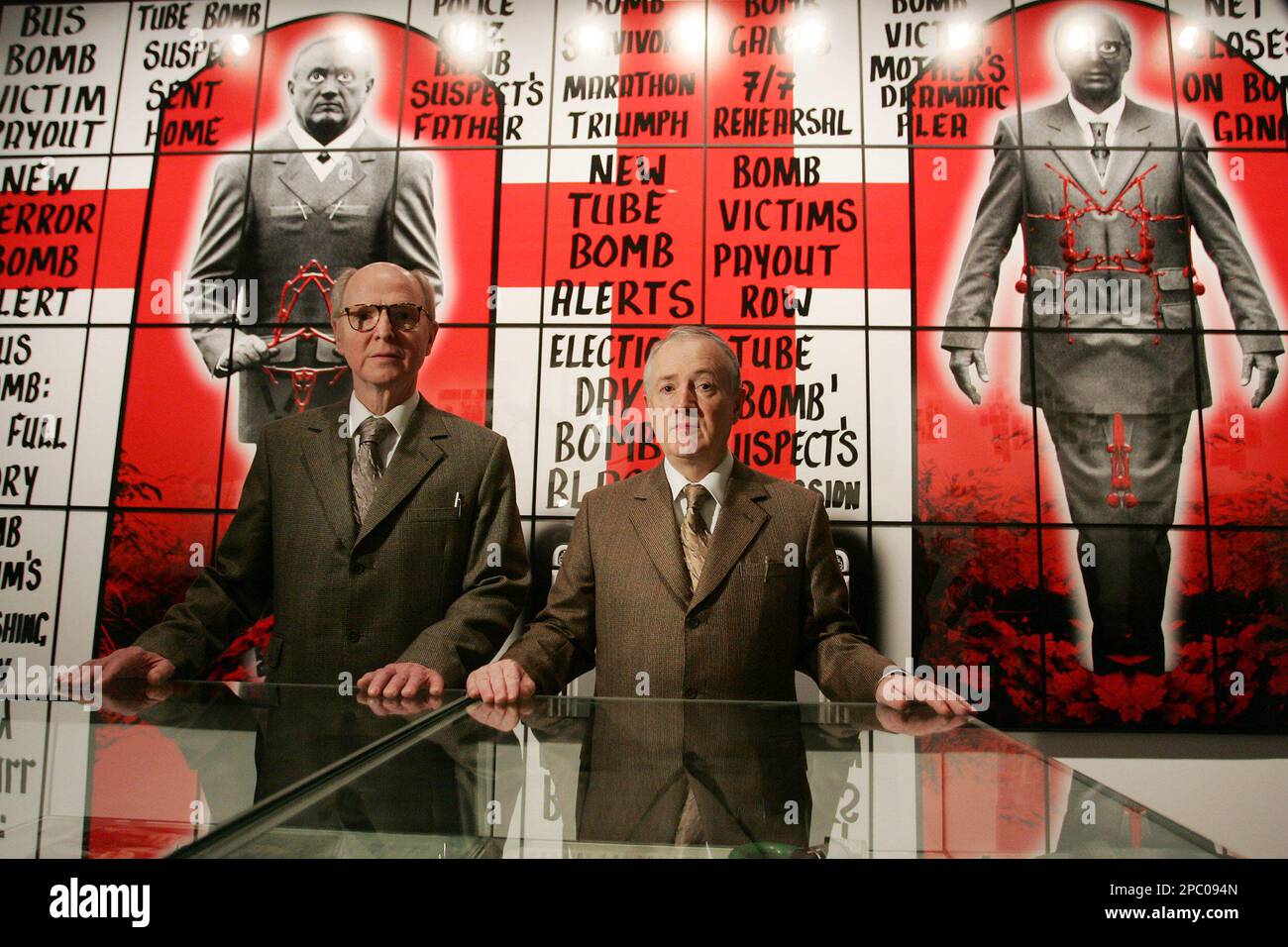 Artists Gilbert and George, left, pose for the media, in front of their ...