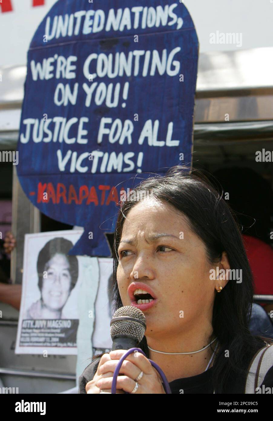 A protester addresses the crowd during a rally coinciding with the ...