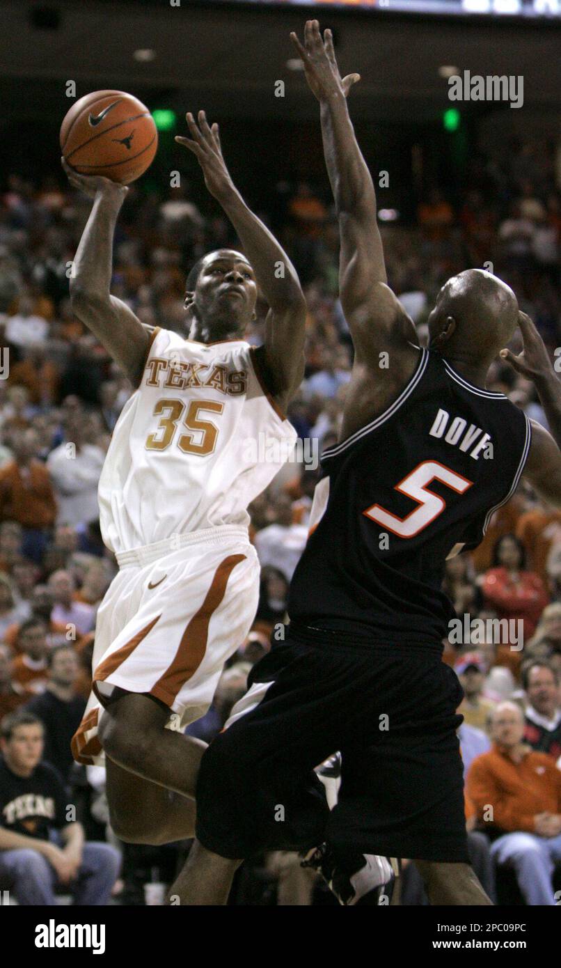 Texas forward Kevin Durant (35) shoots against Oklahoma State defender ...