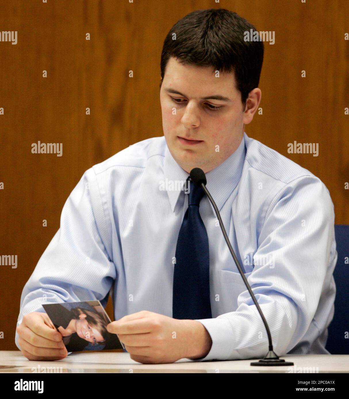 Mike Halbach, brother of Teresa Halbach, holds a photo of his sister ...