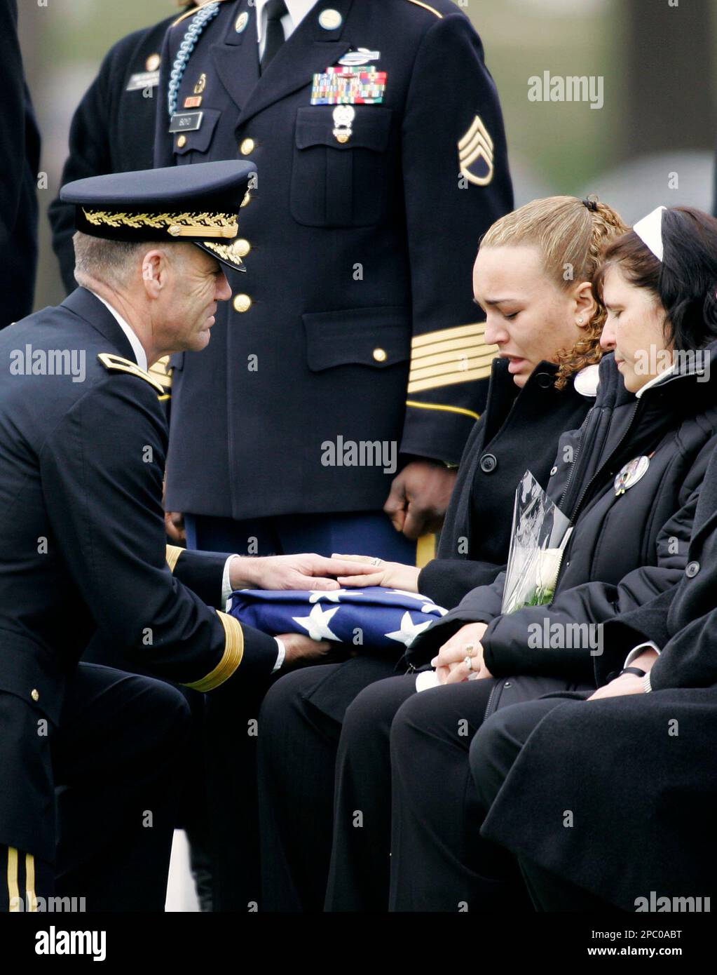 Army Brig. Gen. Rodney Johnson, left, presents the American Flag to ...